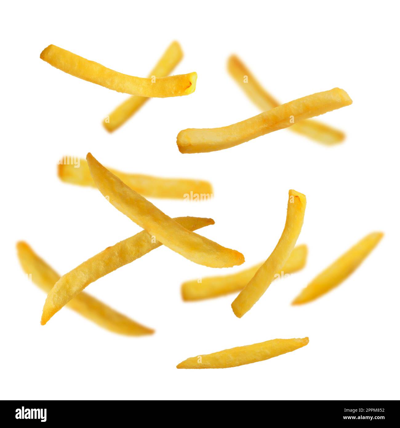Tasty french fries falling on white background Stock Photo - Alamy