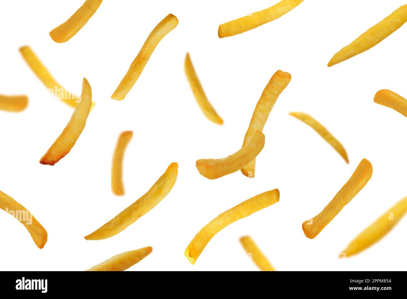 Tasty french fries falling on white background Stock Photo - Alamy