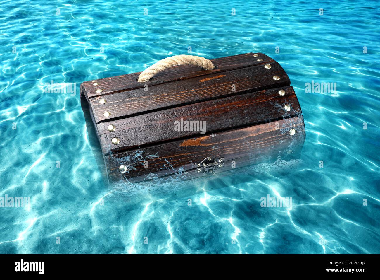 Closed wooden treasure chest floating in sea Stock Photo - Alamy