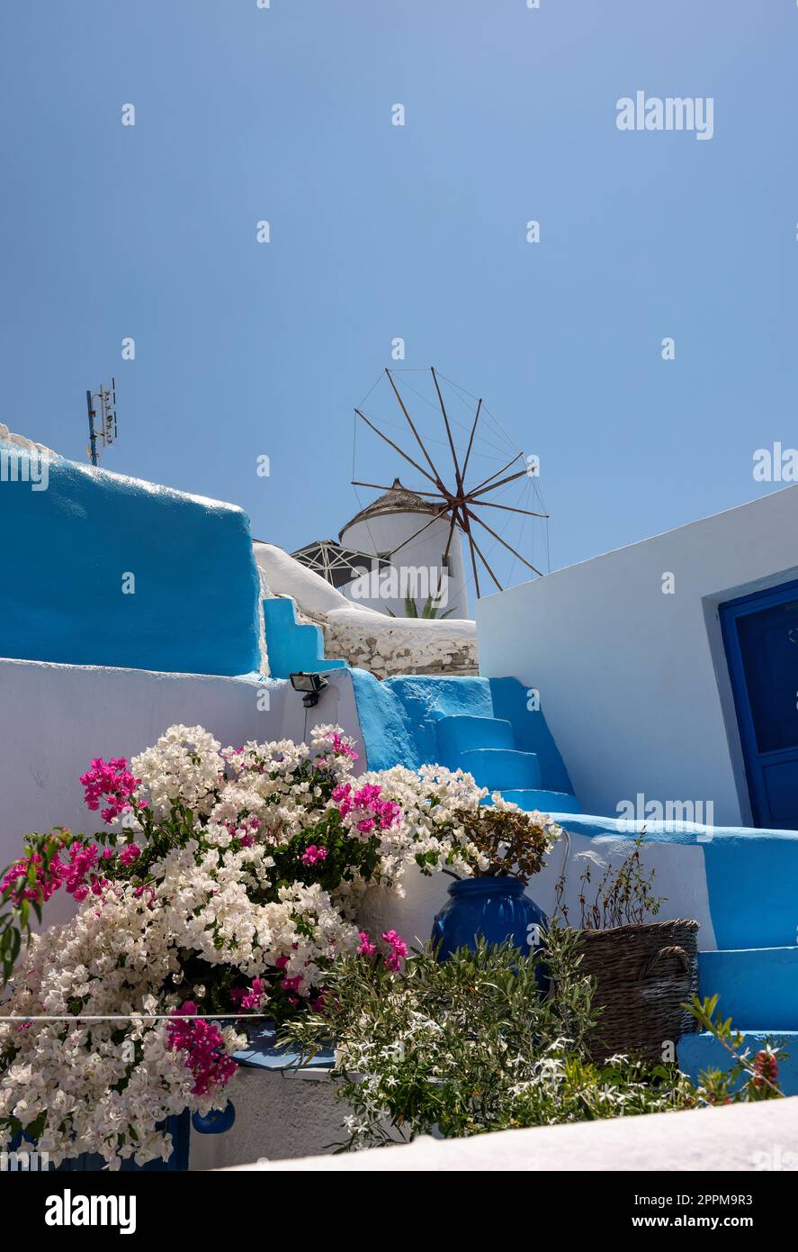 Traditional white windmill in Oia on Santorini Stock Photo - Alamy