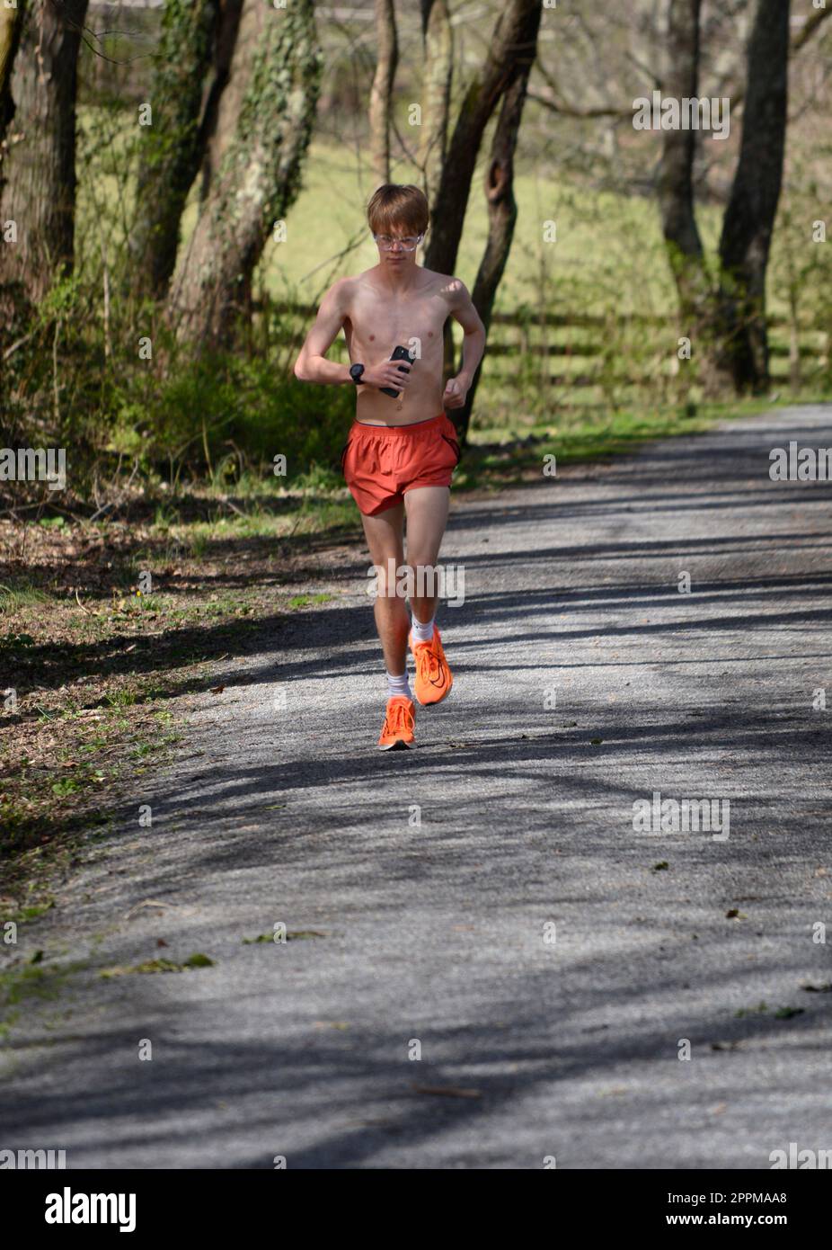 A teenager runs along the Virginia Creeper Trail, a multi-purpose rail ...
