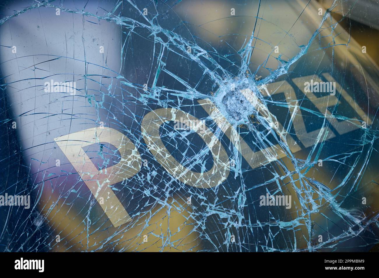 Broken glass and a police car as a symbol of violence against the ...