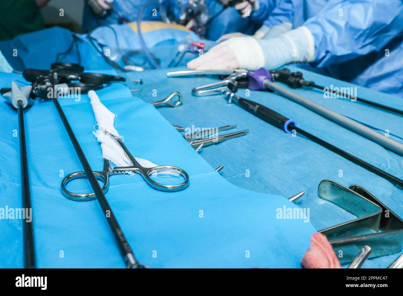 Sterile surgical clamp and other instruments on the table during a ...