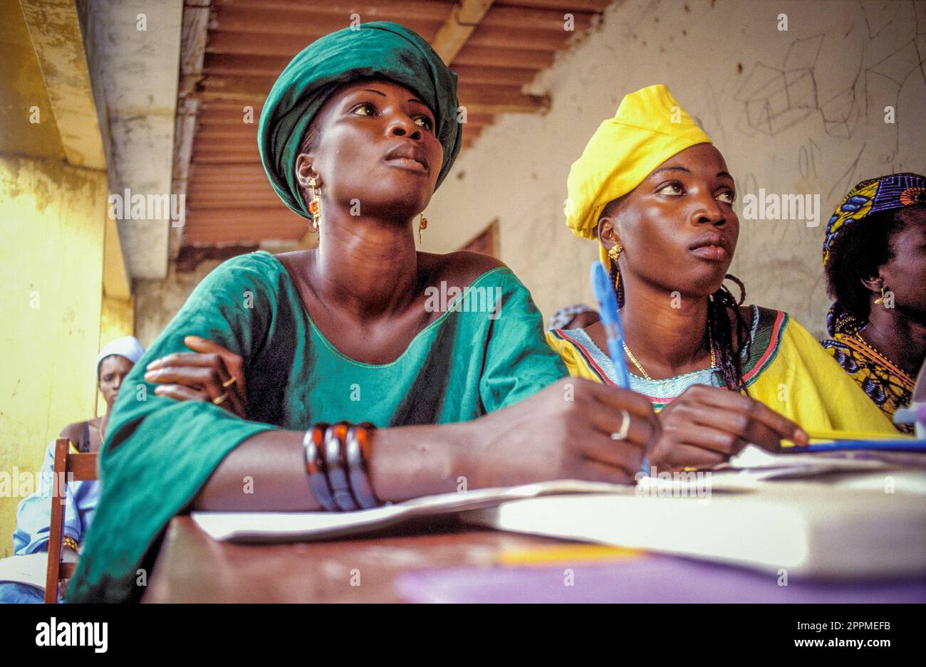 Senegal, Djogo. Women in school, learning to read and write, part of an ...