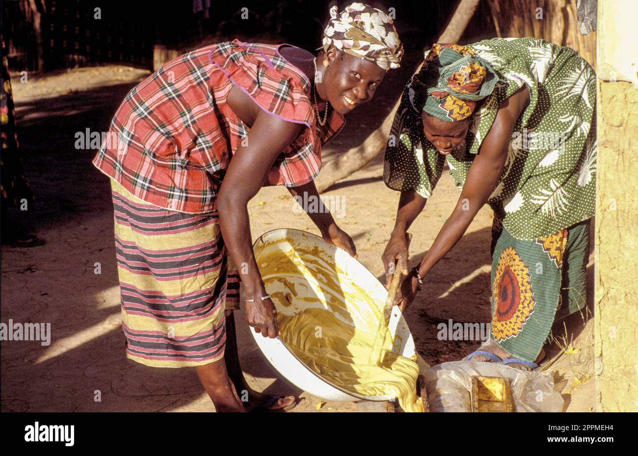 Senegal, Bambay - Women making soap. The handmade soap is from the oil ...