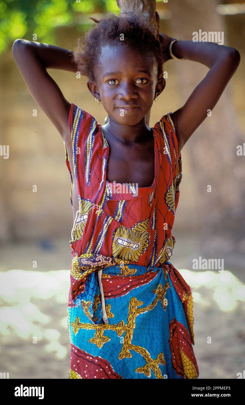 Senegal, girl in a batik dress Stock Photo - Alamy