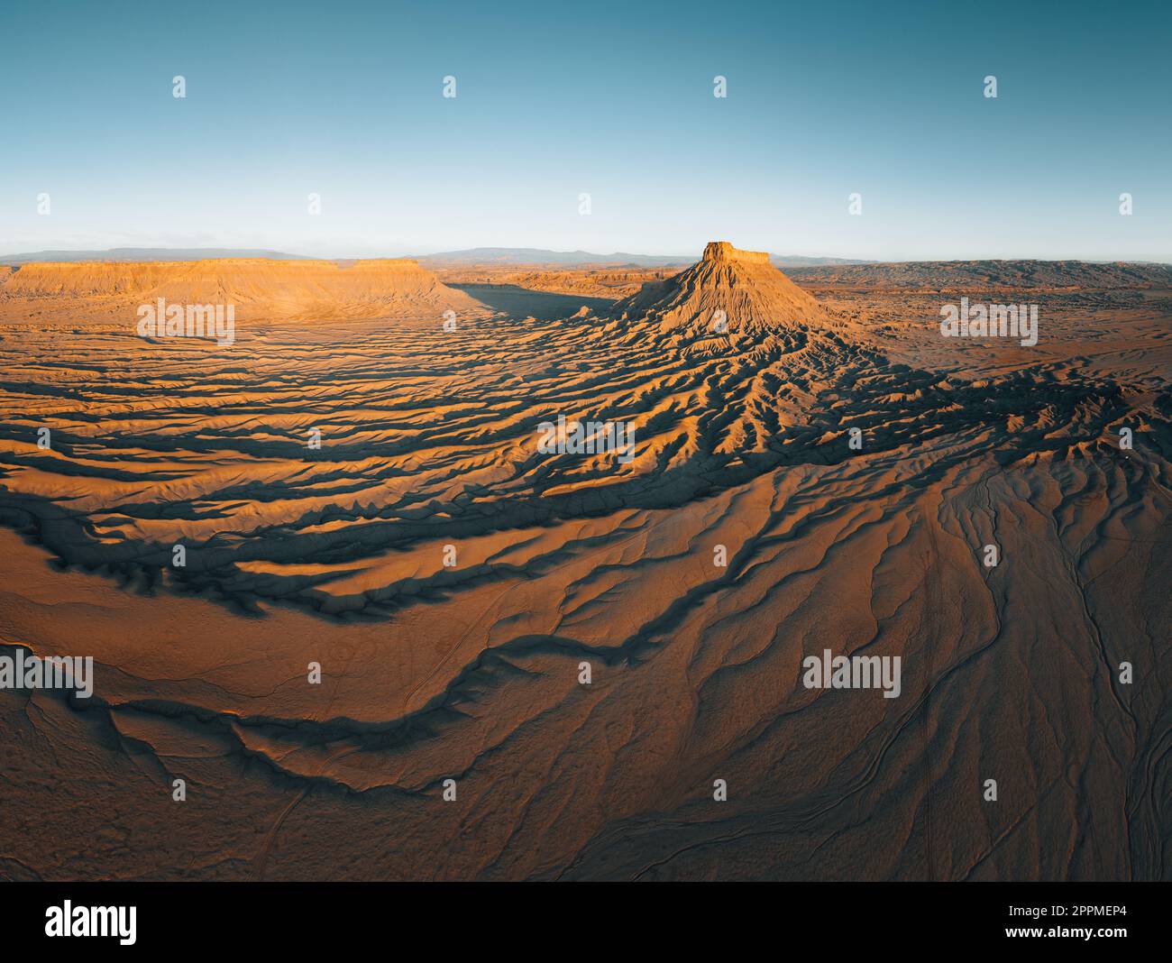 Factory Butte in the Caineville Badlands of Utah. Aerial drone panorama ...