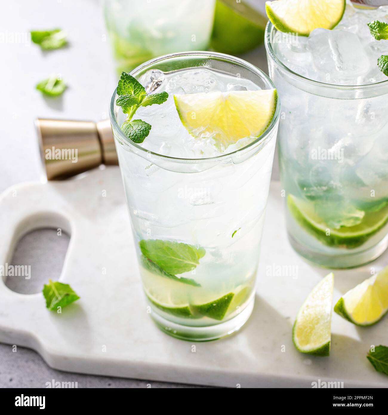Classic mojito cocktail in tall glasses with lime and fresh mint Stock ...