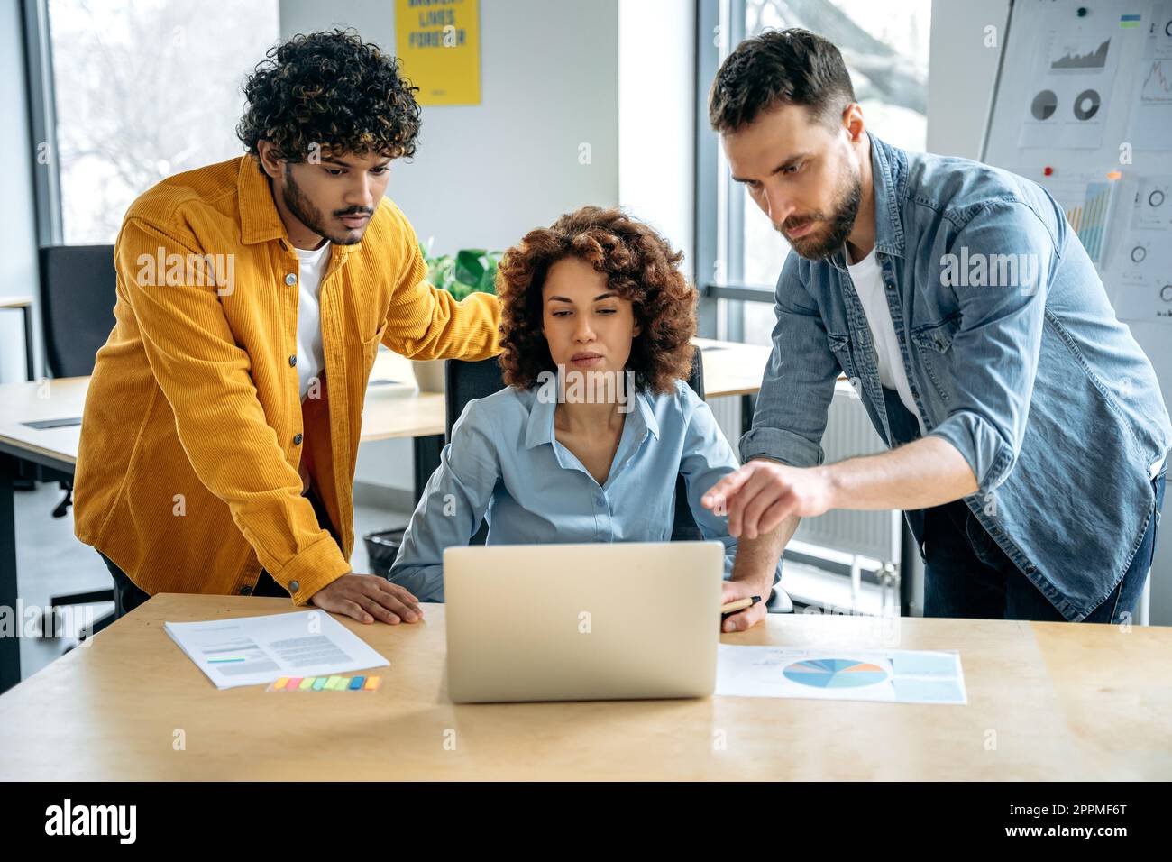 Teamwork, collaboration. Successful focused multiracial people ...