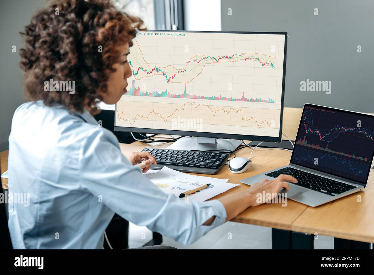 Female trader analyzes price charts hi-res stock photography and images ...