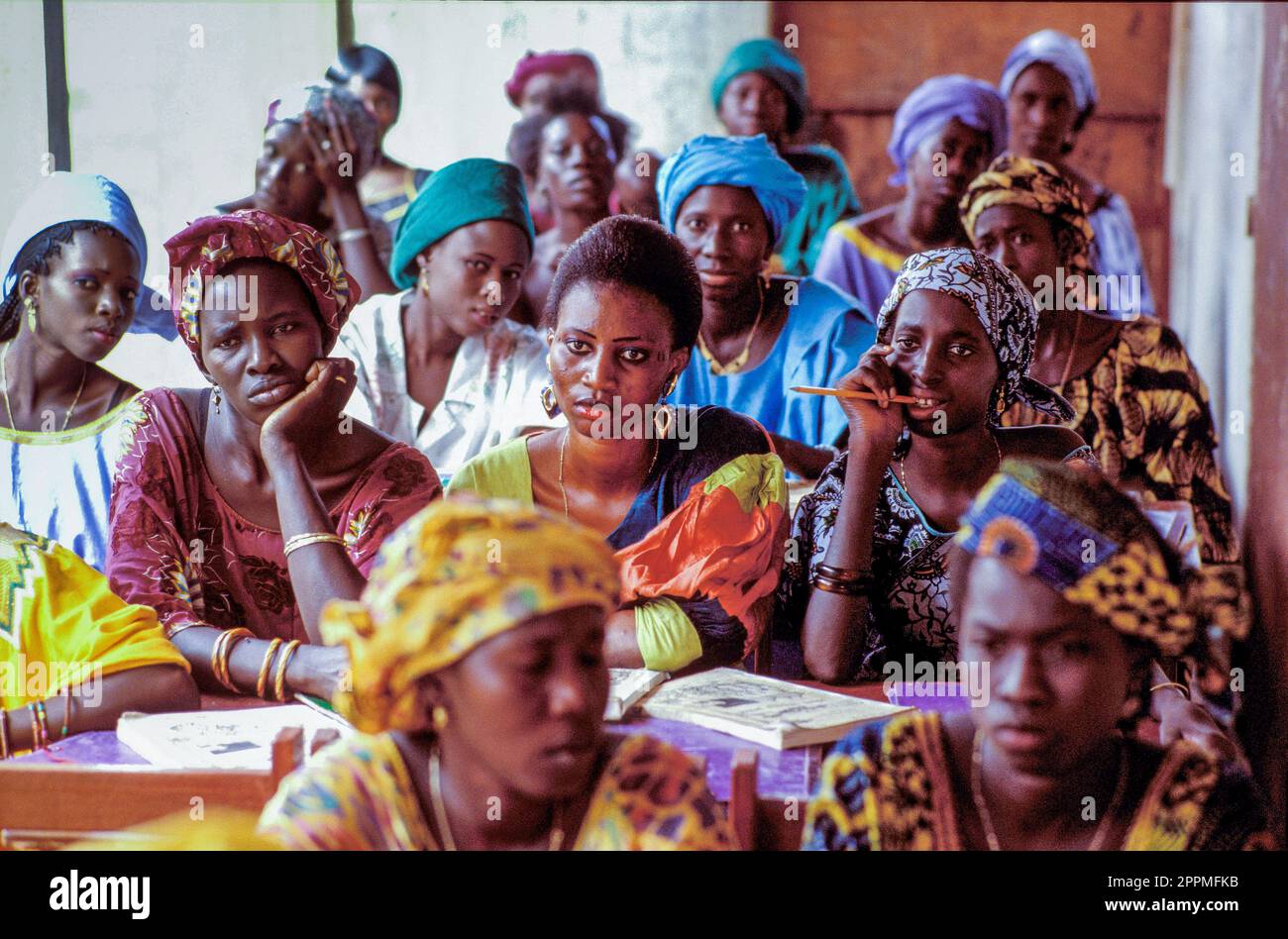 Senegal, Djogo. Women in school, learning to read and write, part of an ...