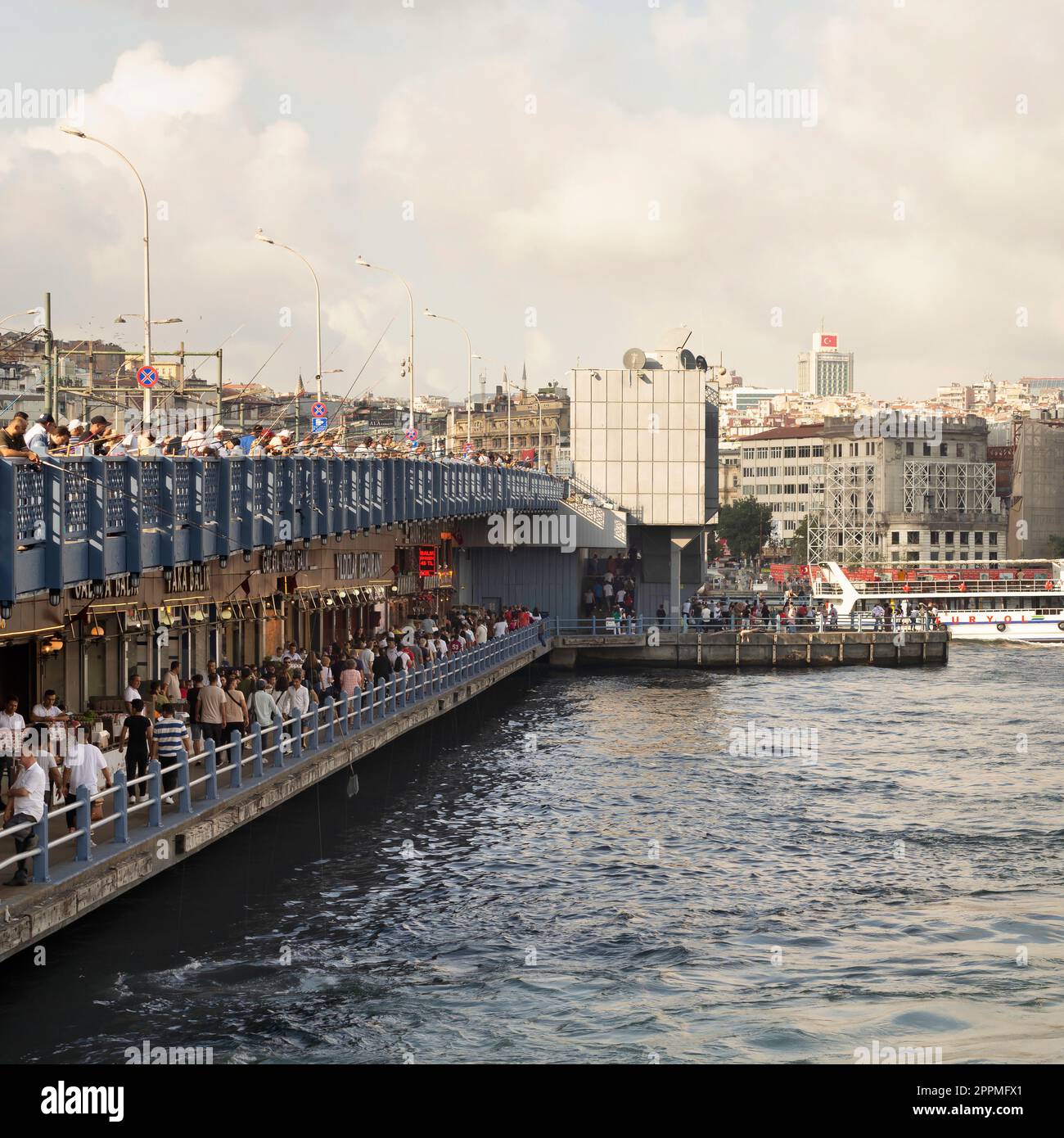 Fish restaurants at crowded Galata Bridge, during the Victory Day ...