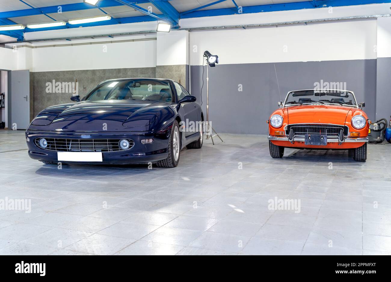 luxury cars in the garage Stock Photo - Alamy