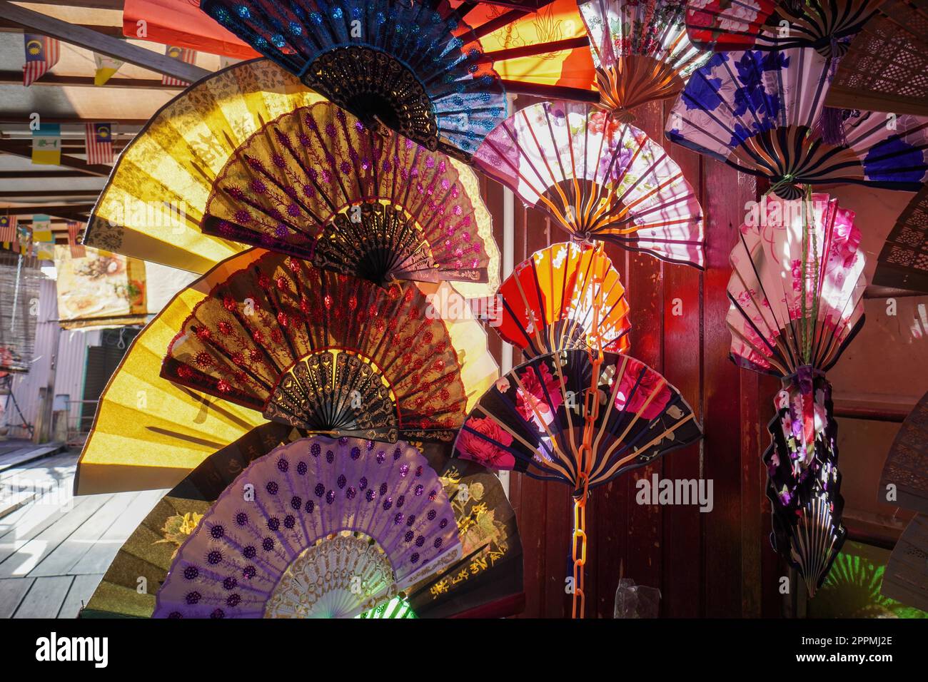 Different colorful Chinese fan with the sun light at back Stock Photo ...