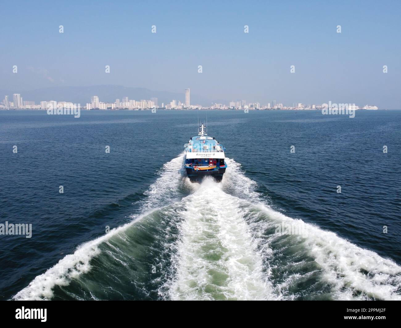 Passenger ferry move at sea with wave at back Stock Photo - Alamy