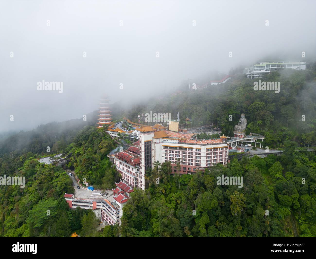An aerial view of the Chin Swee Caves Temple and the surrounding trees ...