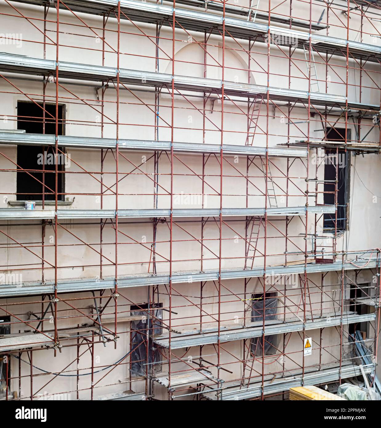 Scaffolding installed on a building under renovation Stock Photo - Alamy
