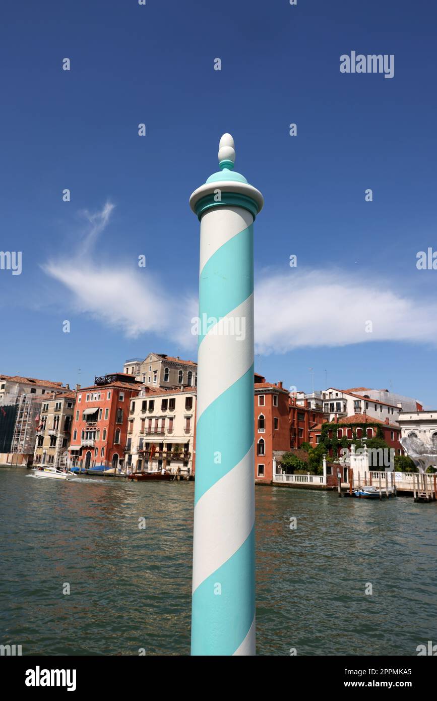 Blue and white wooden mooring pole in Venice Stock Photo - Alamy