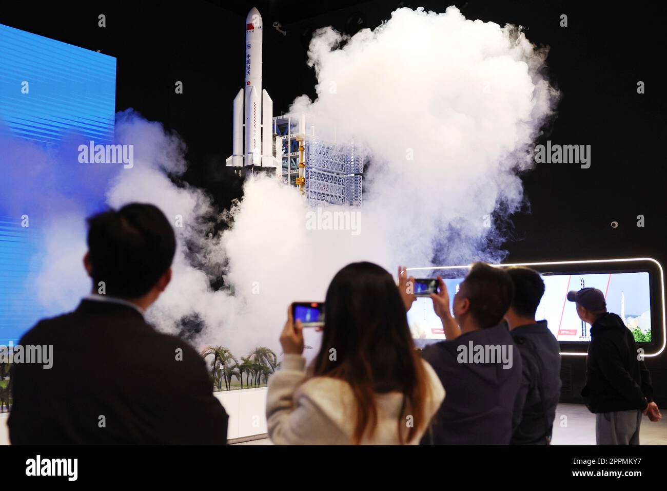 Beijing, China. 24th Apr, 2023. Visitors watch a simulation of the ...