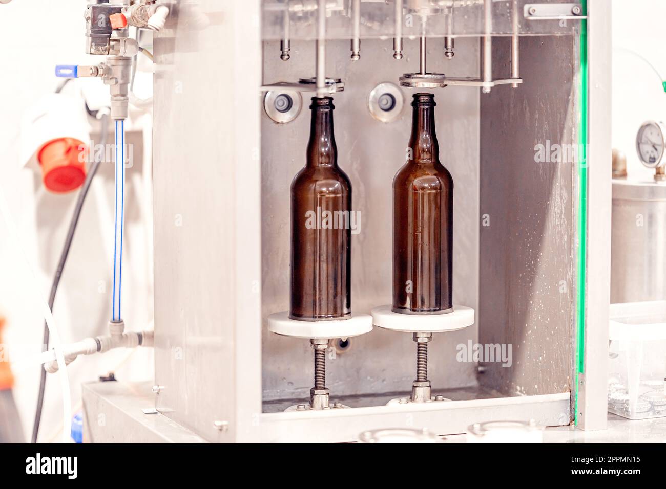 machine for automatic filling of beer bottles in a brewery Stock Photo ...