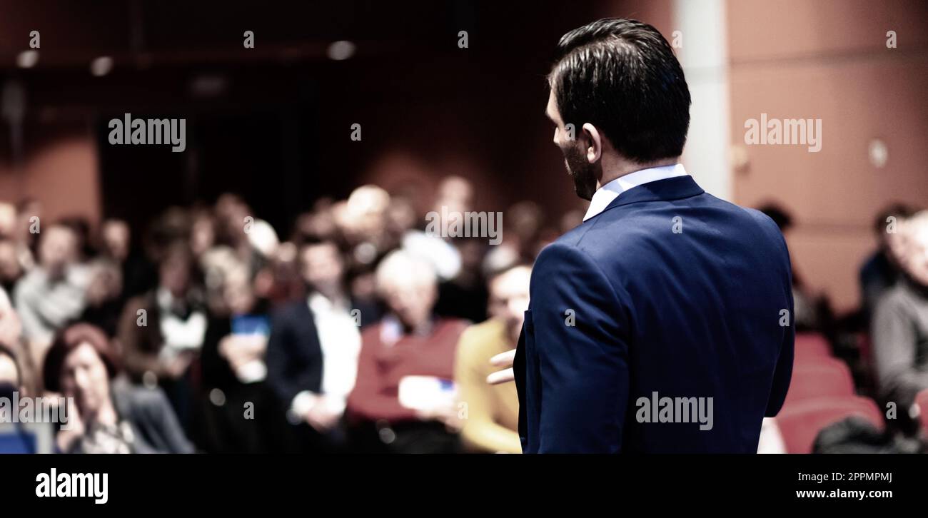 Speaker giving a talk on corporate Business Conference. Audience at the ...