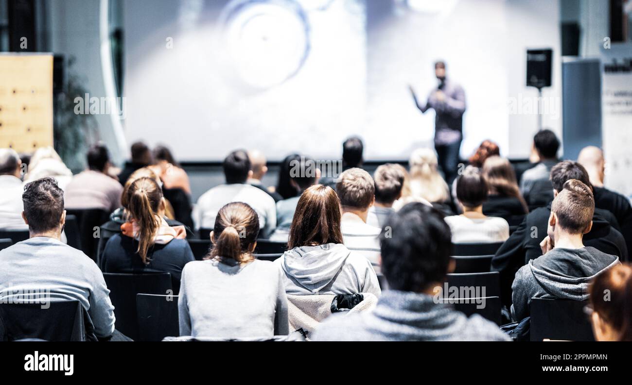 Speaker giving a talk in conference hall at business event. Audience at ...