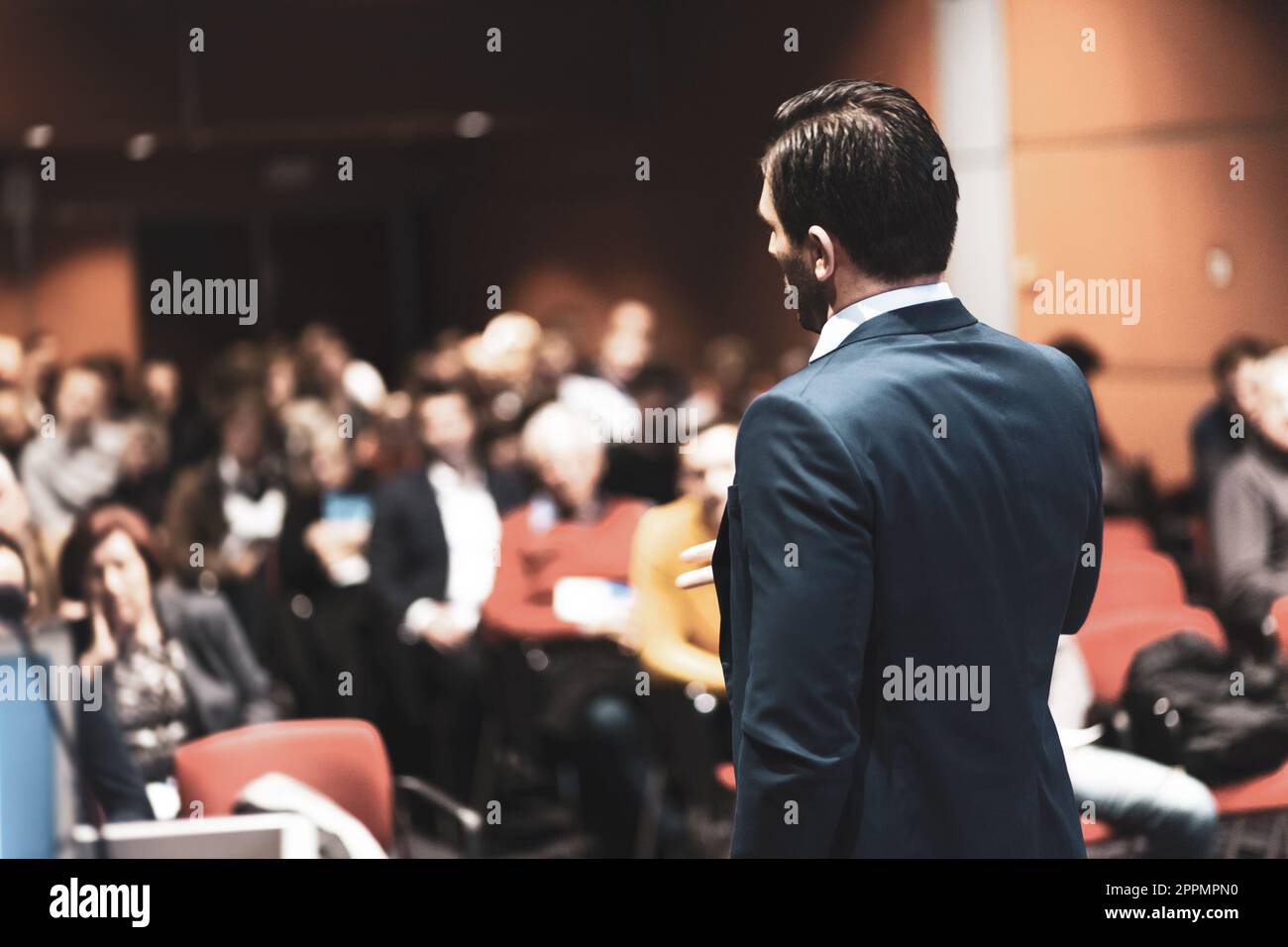 Speaker giving a talk on corporate Business Conference. Audience at the ...