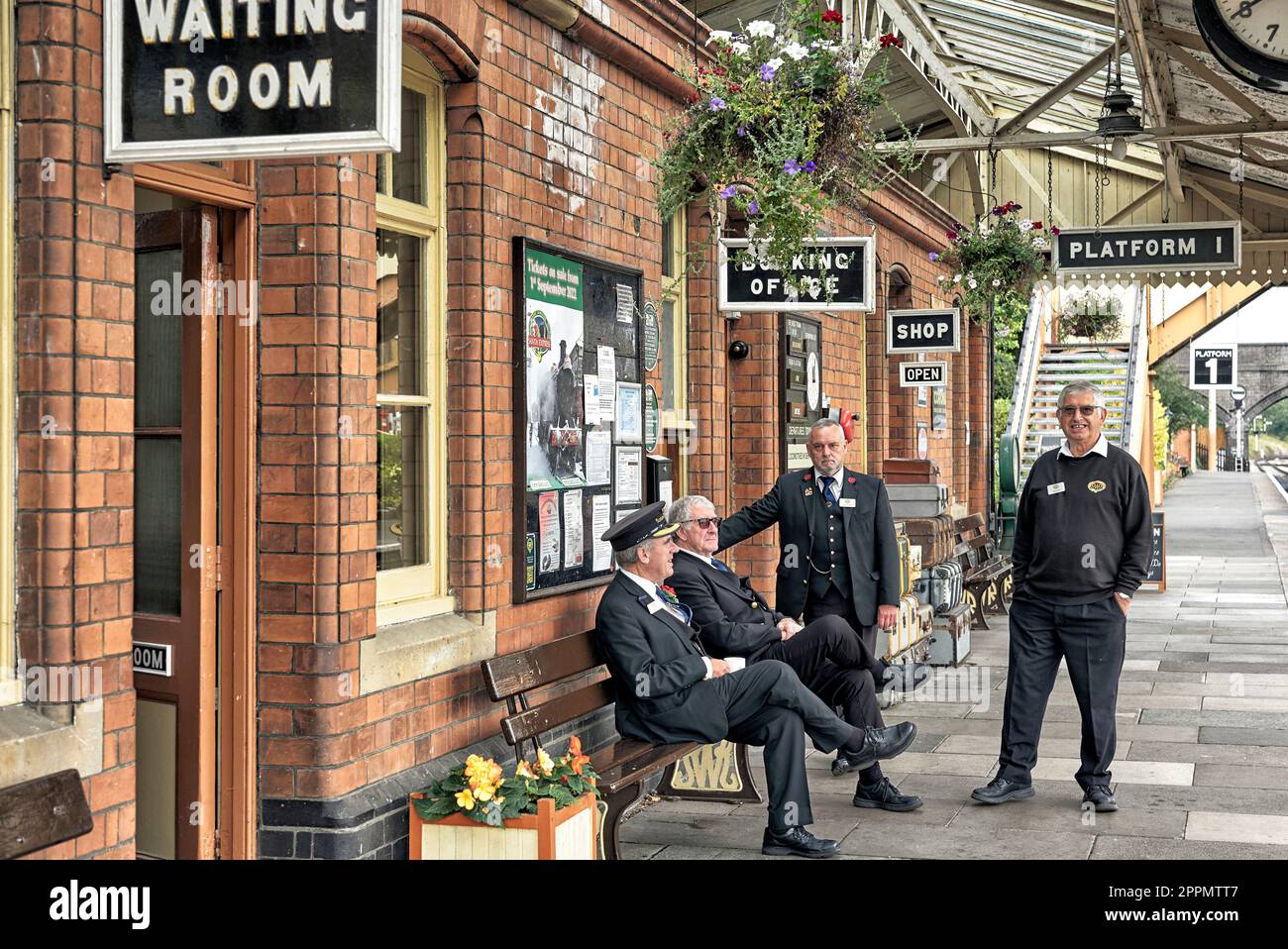 Station personnel at the GWR preserved railway station Toddington ...