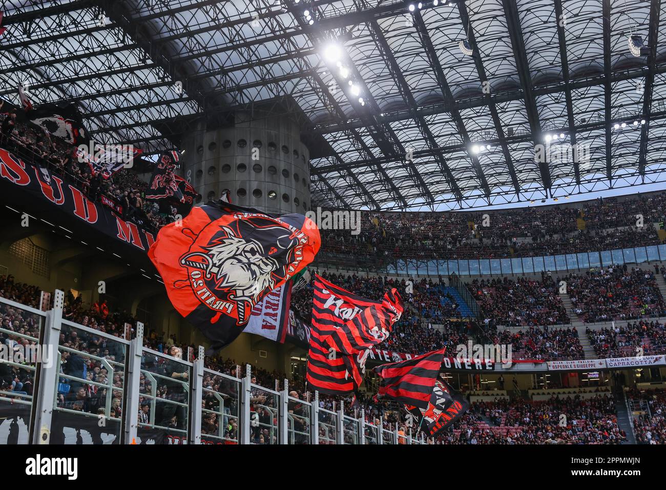 Milan, Italy. 23rd Apr, 2023. AC Milan supporters wave giant flags ...