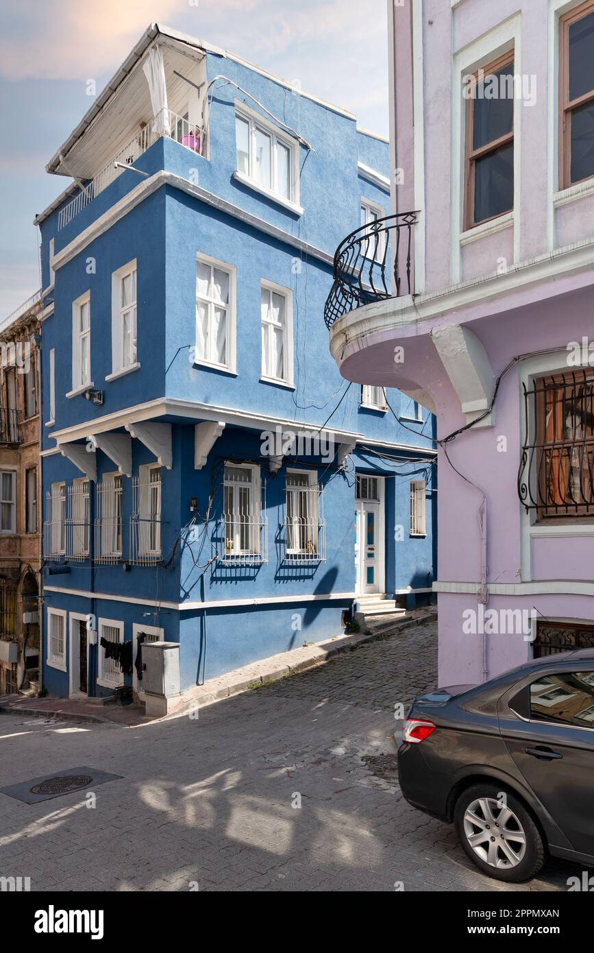 Cobblestone alley with beautiful old traditional blue house in Balat ...
