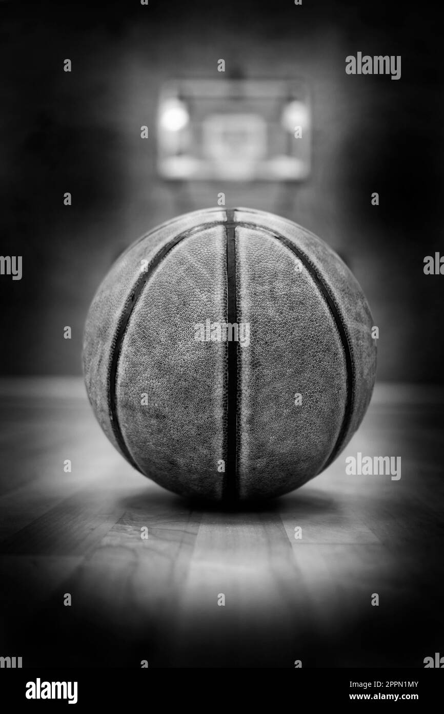 Basketball court with ball hoops rims hardwood floor and lights for ...