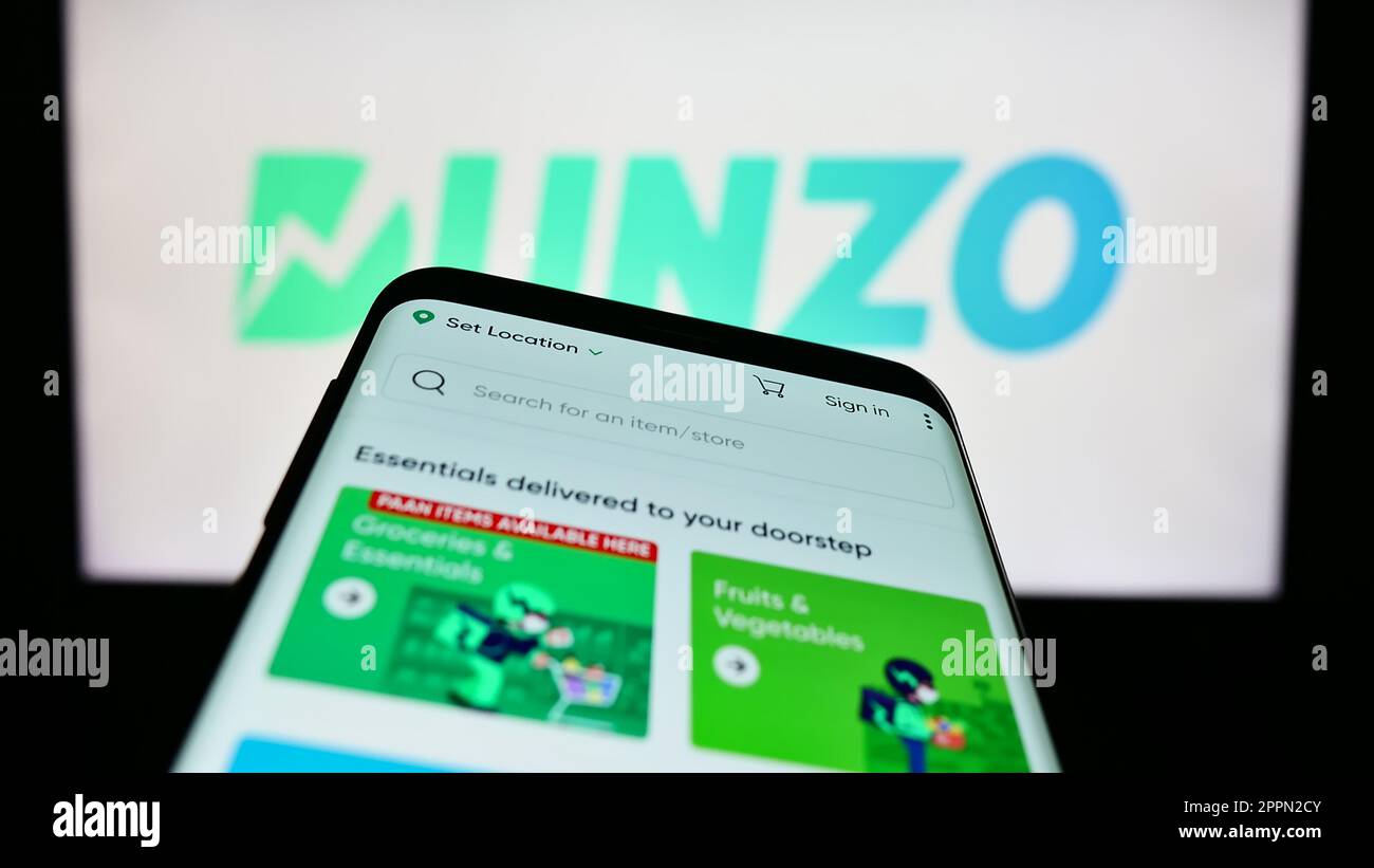 Smartphone with webpage of Indian delivery app company Dunzo Digital on ...