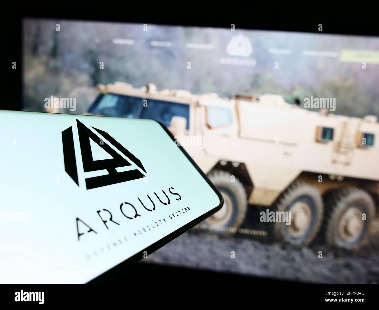 Mobile phone with logo of French defence company Arquus SAS on screen ...