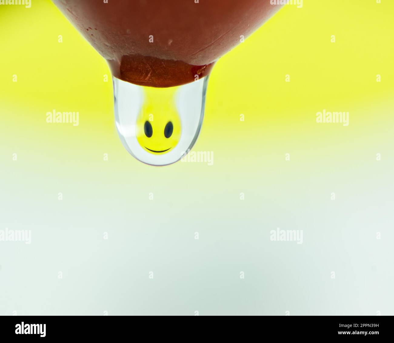 Macro of a happy smiley refraction in a water drop Stock Photo - Alamy