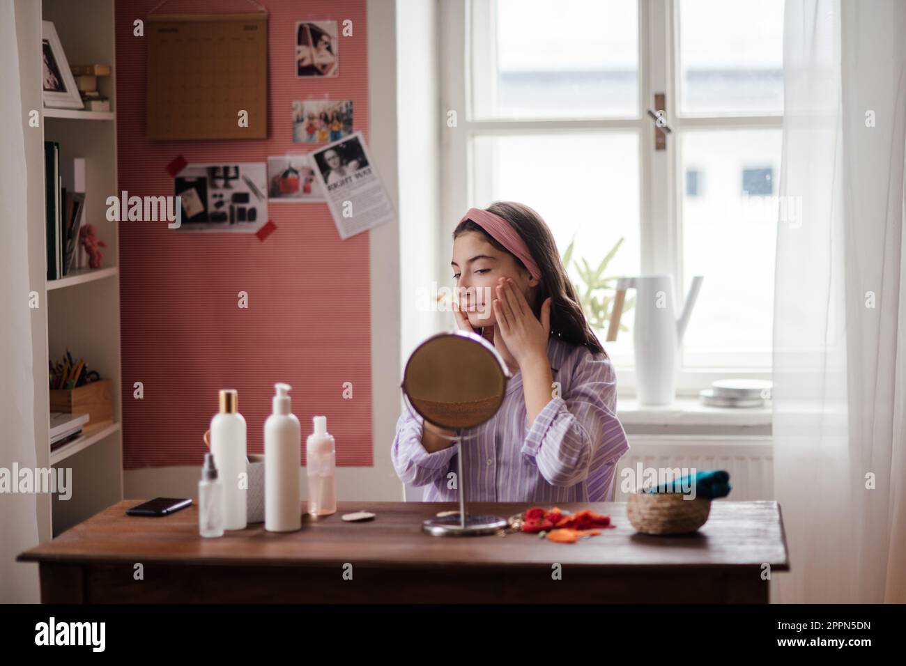 Teenage girl doing her skin care routine Stock Photo - Alamy