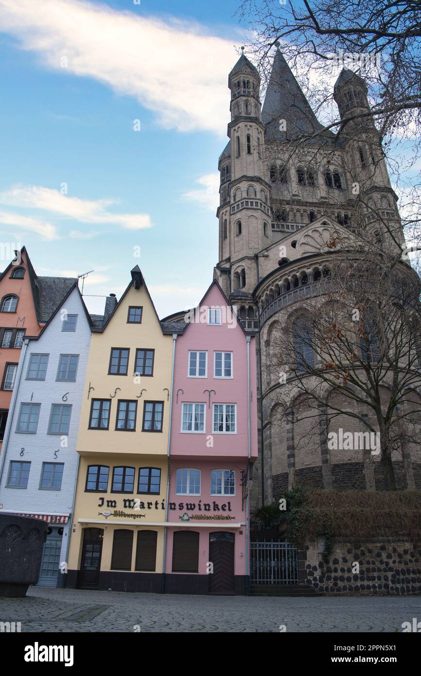 typical colorful old houses next to the romanesque church Gross ST ...