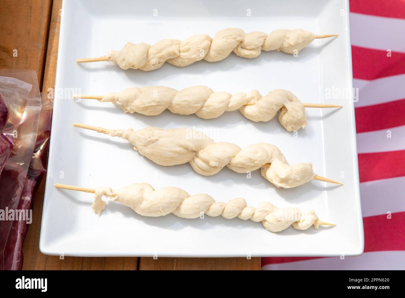 raw stick bread ready for barbecue Stock Photo - Alamy
