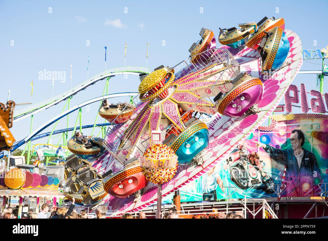 MUNICH, GERMANY - SEPTEMBER 30: Fairground rides at the Oktoberfest in ...
