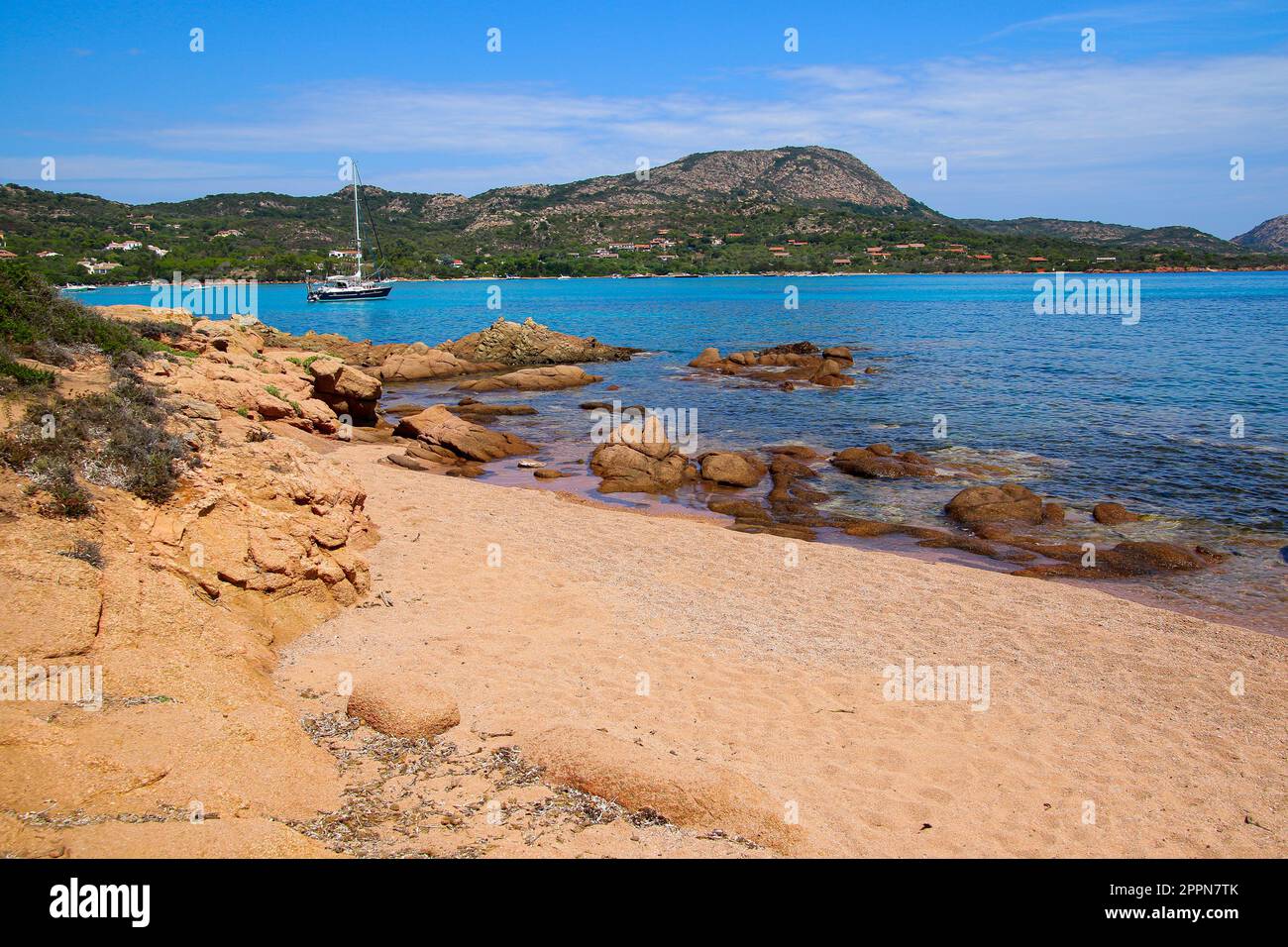 Shallow waters on a small sandy beach in the bay of Porto Istana on the ...