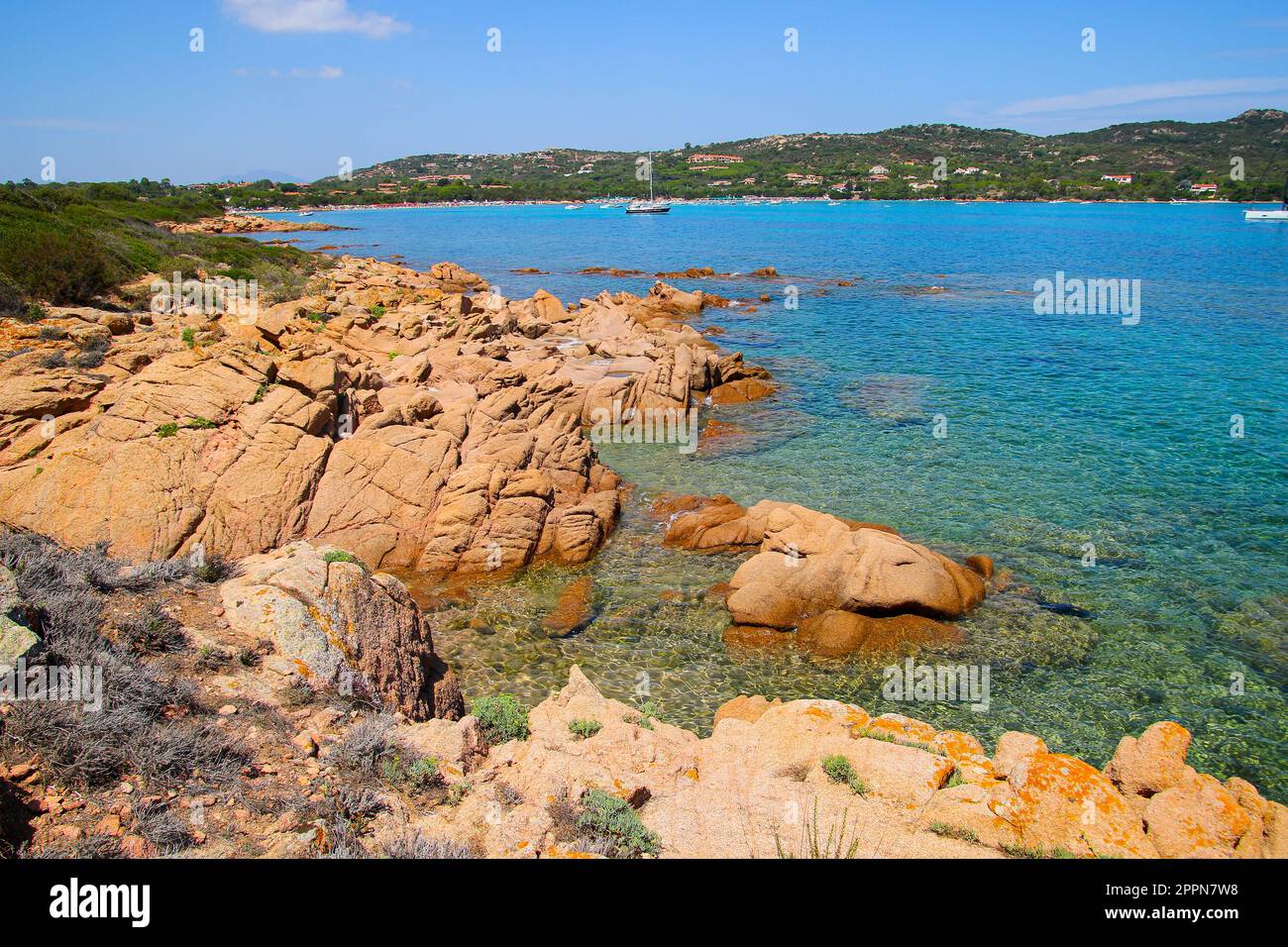 Semi-submerged rock in the blue waters of the Mediterranean Sea on the ...