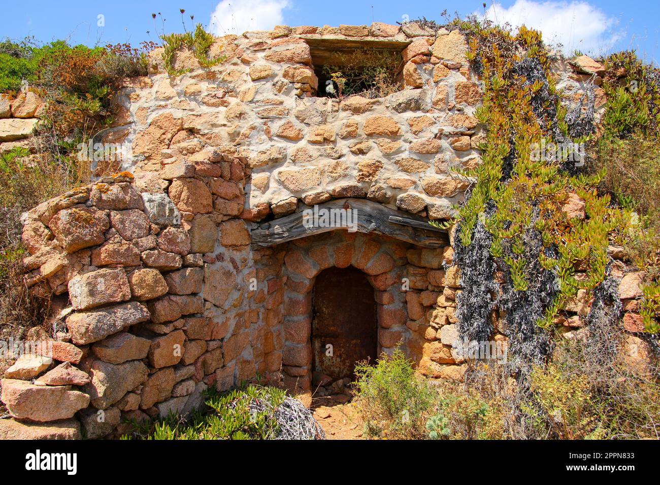 Ancient lime kiln on the beach of La Finosa in the bay of Porto Istana ...