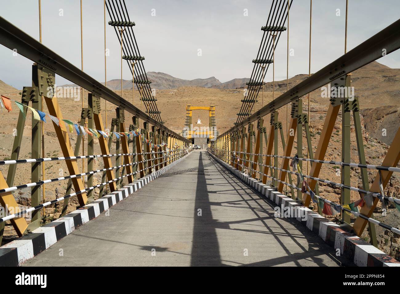Suspension bridge spanning deep gorge over Spiti river and connecting ...