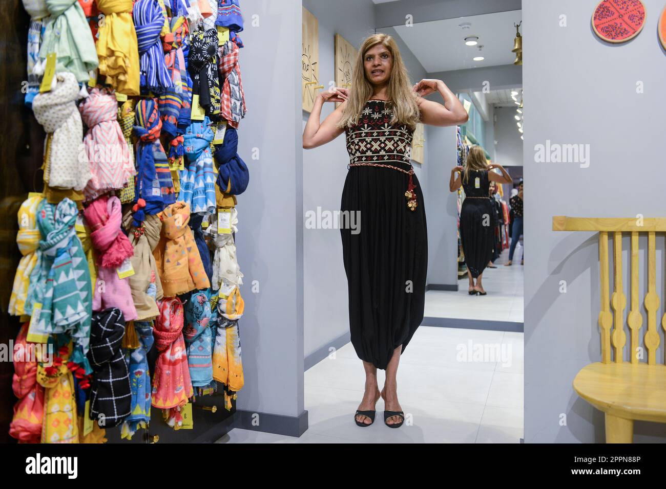 INDIA, Mumbai, Malad, InOrbit shopping mall, woman in textile boutique ...