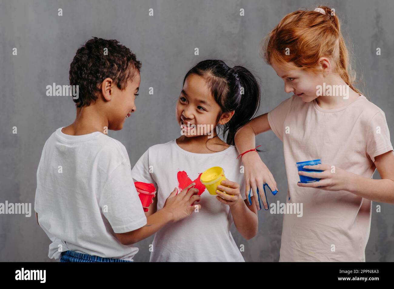 Portrait of happy kids with finger colours and painted hands Stock ...