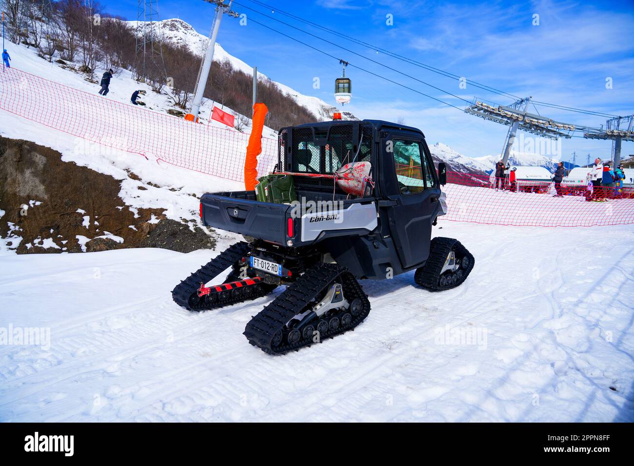 Les Ménuires, France - March 16, 2023 : Snowmobile on caterpillar ...