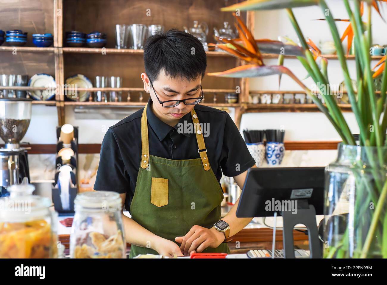 Vietnamese man cashier hi-res stock photography and images - Alamy