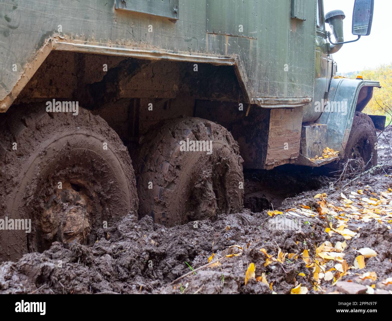 green Russian Cargo Truck stuck in the mud. Soviet military truck URAL ...