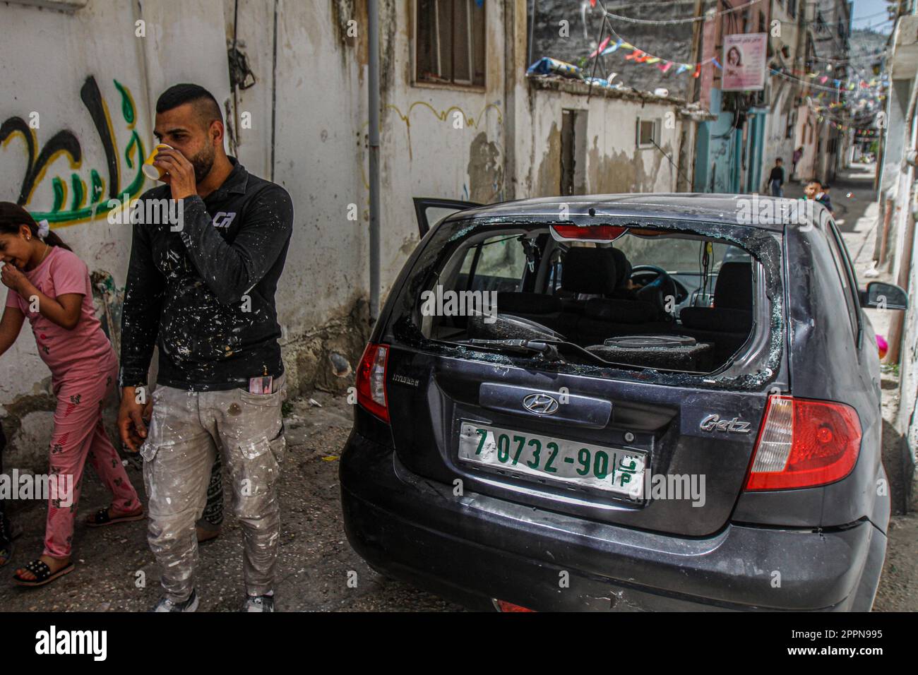 Nablus, Palestine. 24th Apr, 2023. Palestinians Inspect a destroyed car ...