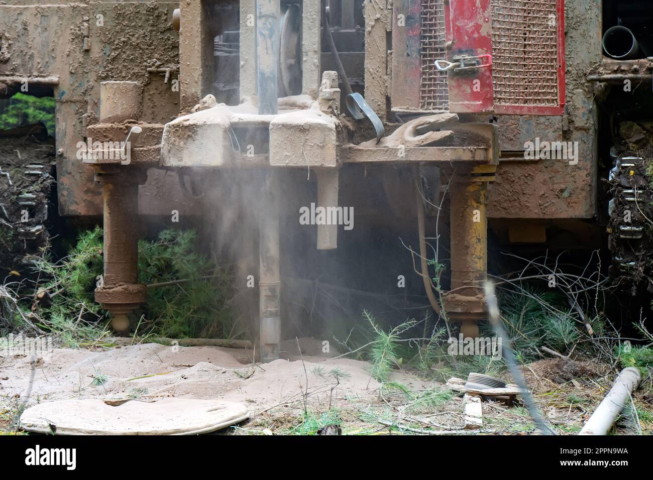 Crawler drilling rig drills well, lot of dust when drilling borehole ...