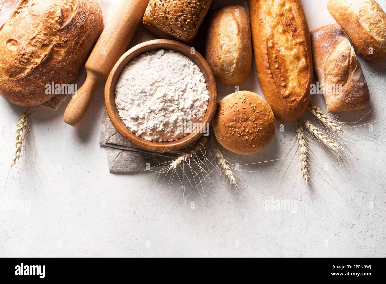Assortment of various delicious freshly baked bread and flour ...